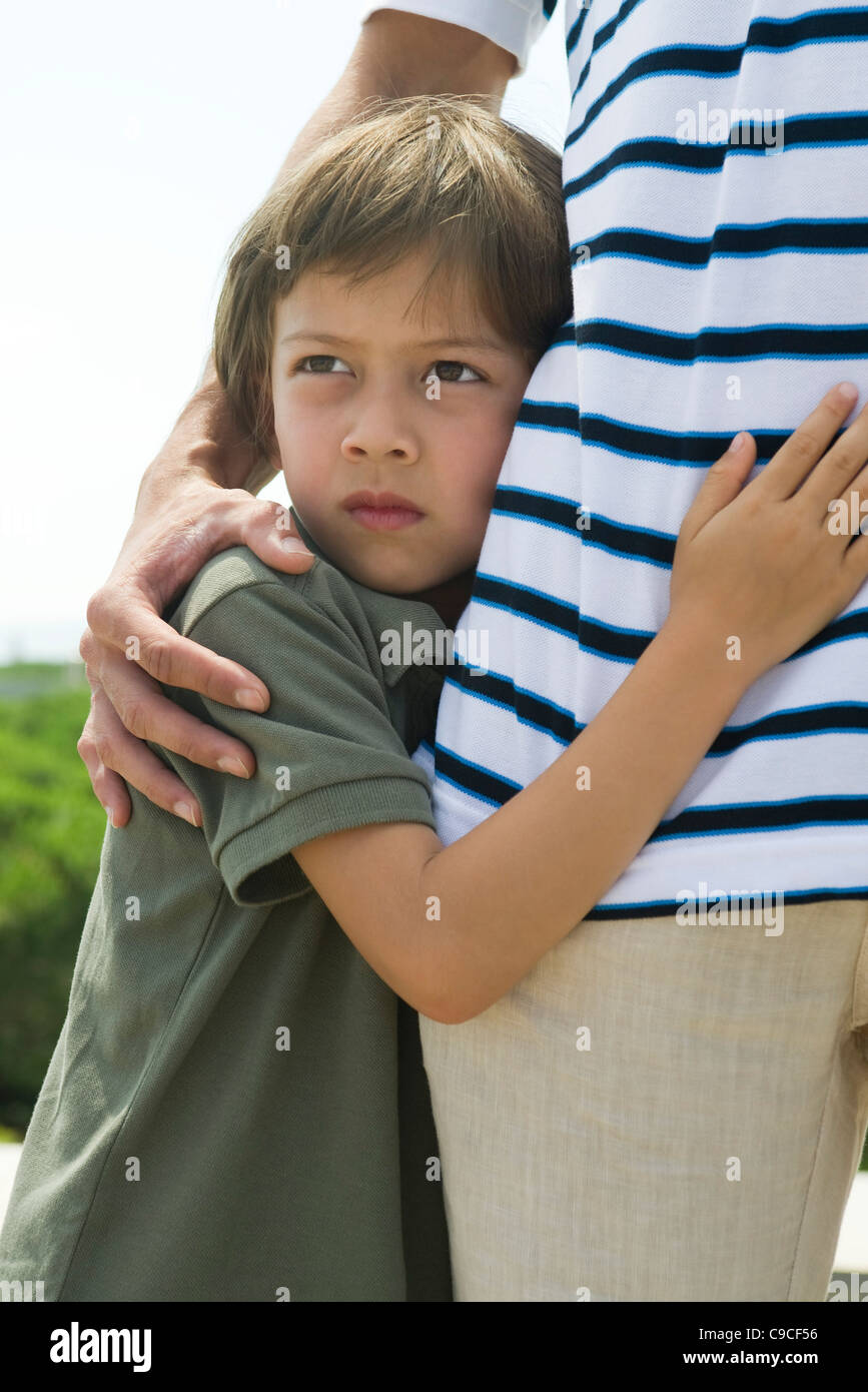Boy embracing father, cropped Stock Photo - Alamy
