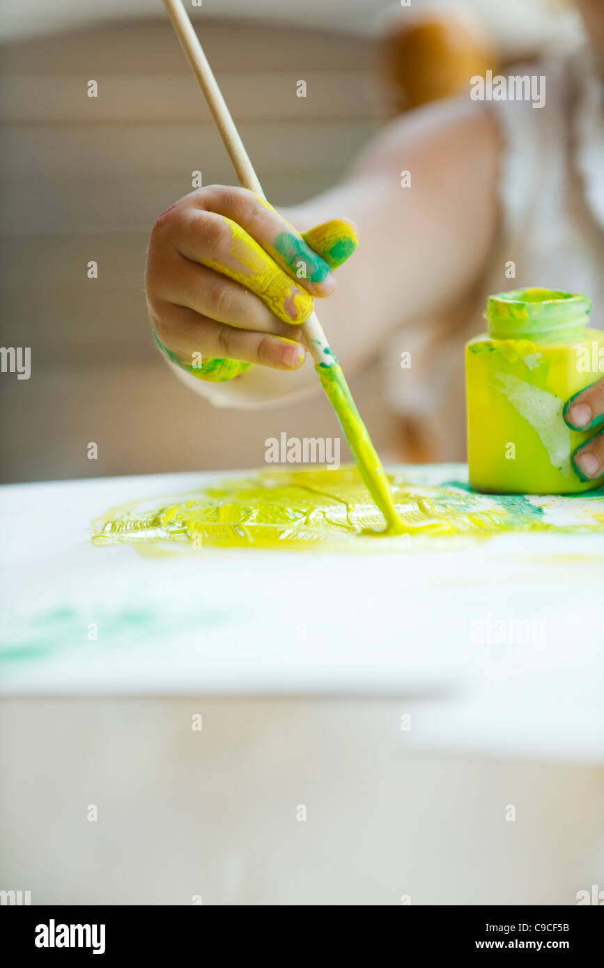 Child painting with paintbrush, cropped Stock Photo - Alamy