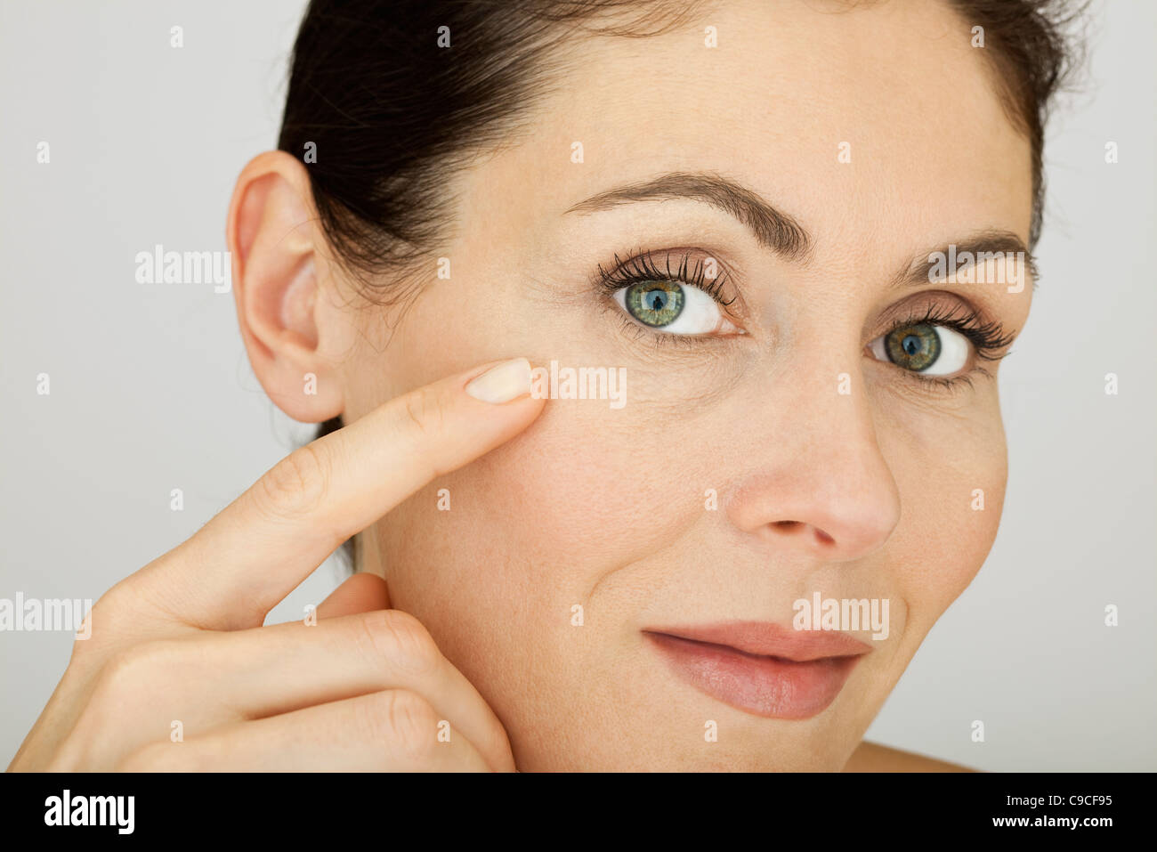 Woman touching face, portrait Stock Photo - Alamy