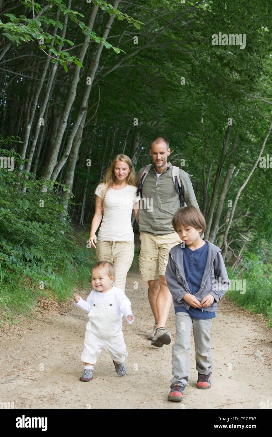 Family hiking in woods Stock Photo - Alamy