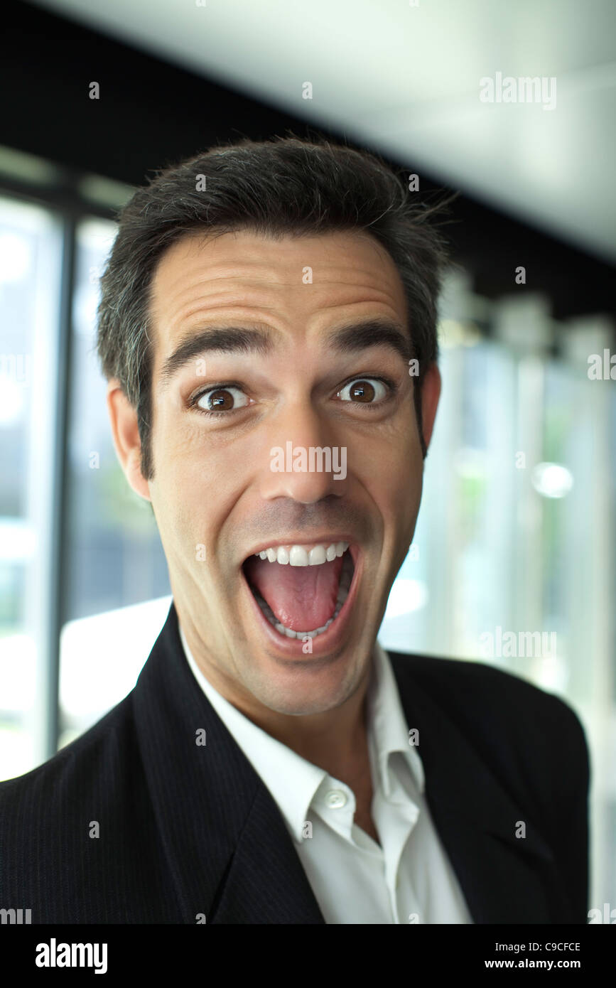 Executive making surprised face Stock Photo - Alamy