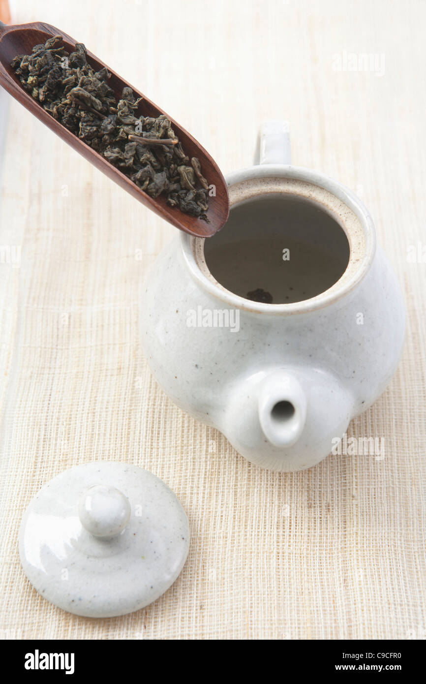 Tea pot and leaves hi-res stock photography and images - Alamy