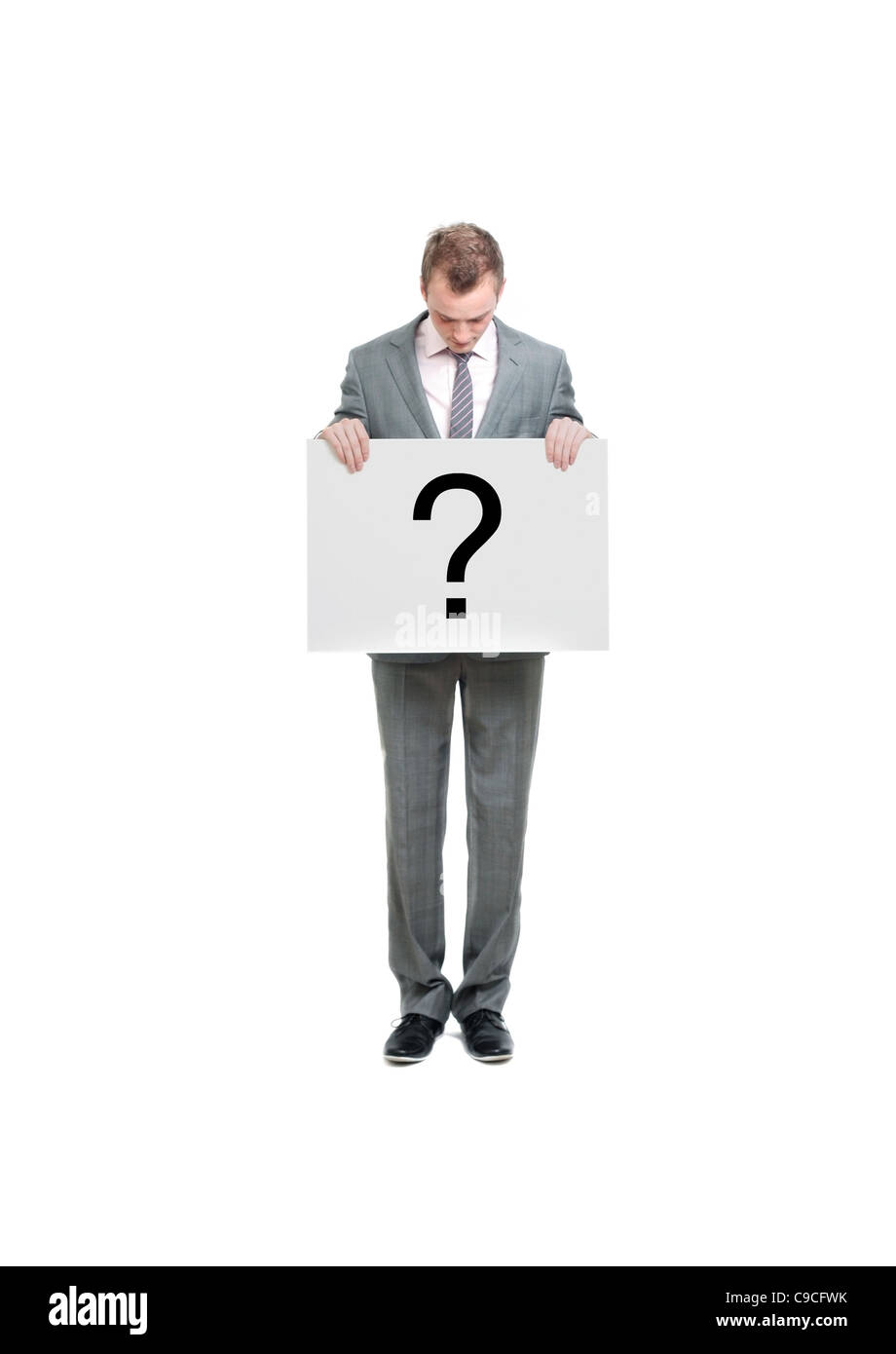A business man holding a question mark Stock Photo - Alamy