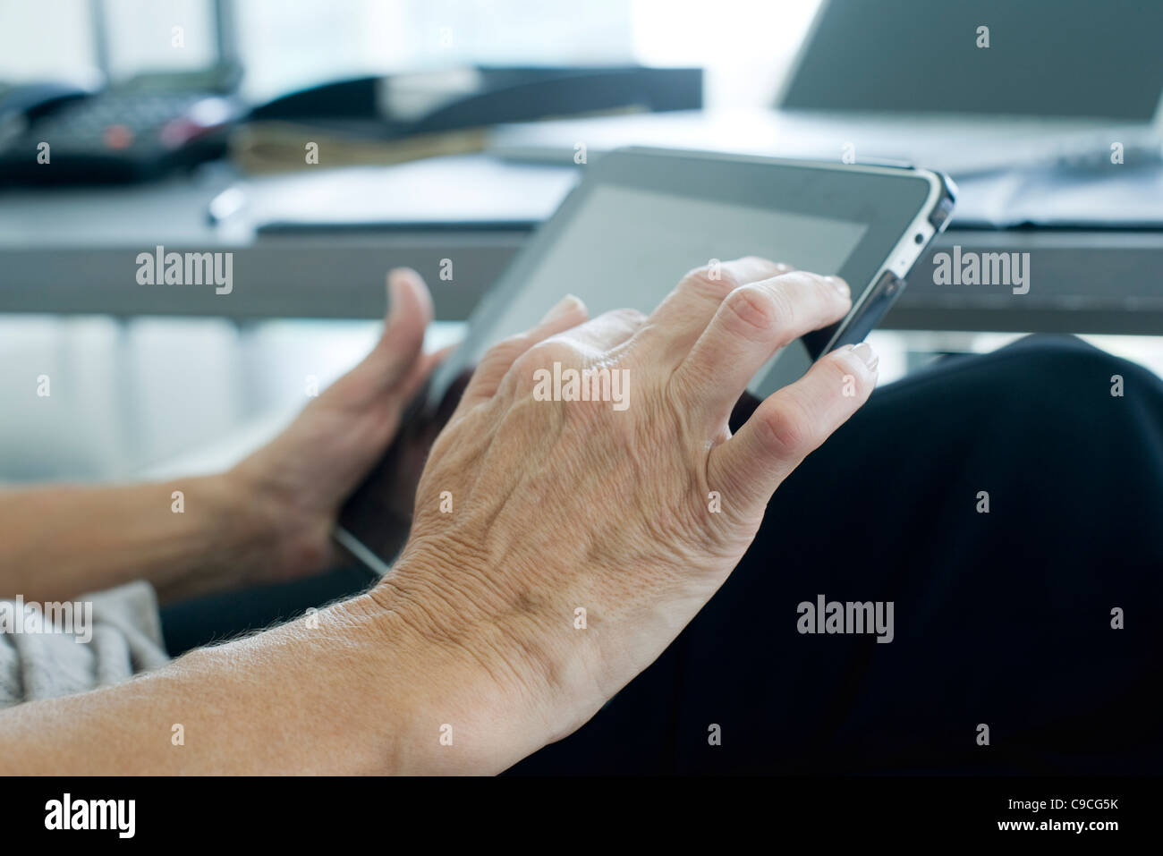 Woman's hand touching digital tablet screen Stock Photo - Alamy