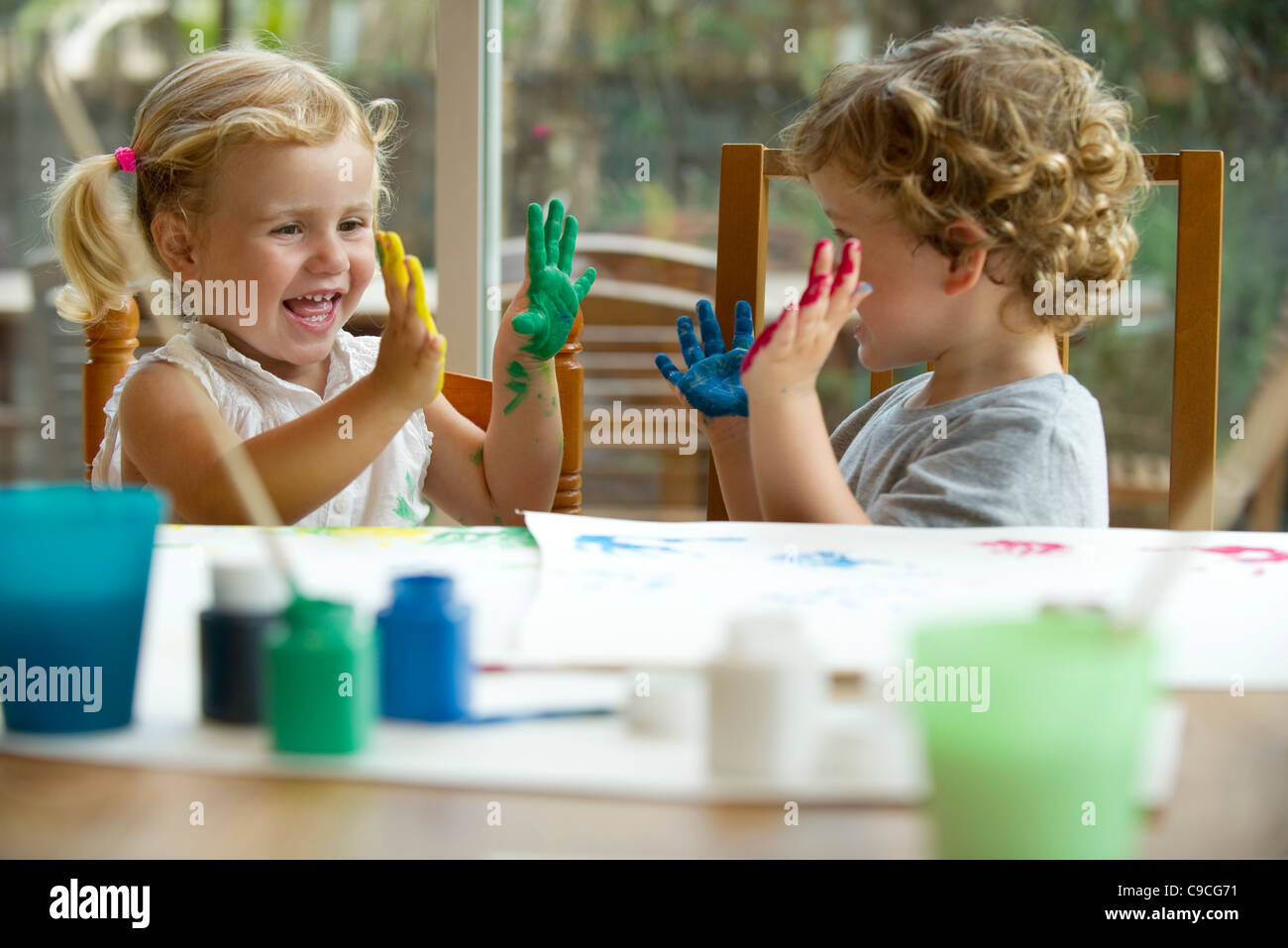 Kids hand covered in paint hi-res stock photography and images - Alamy