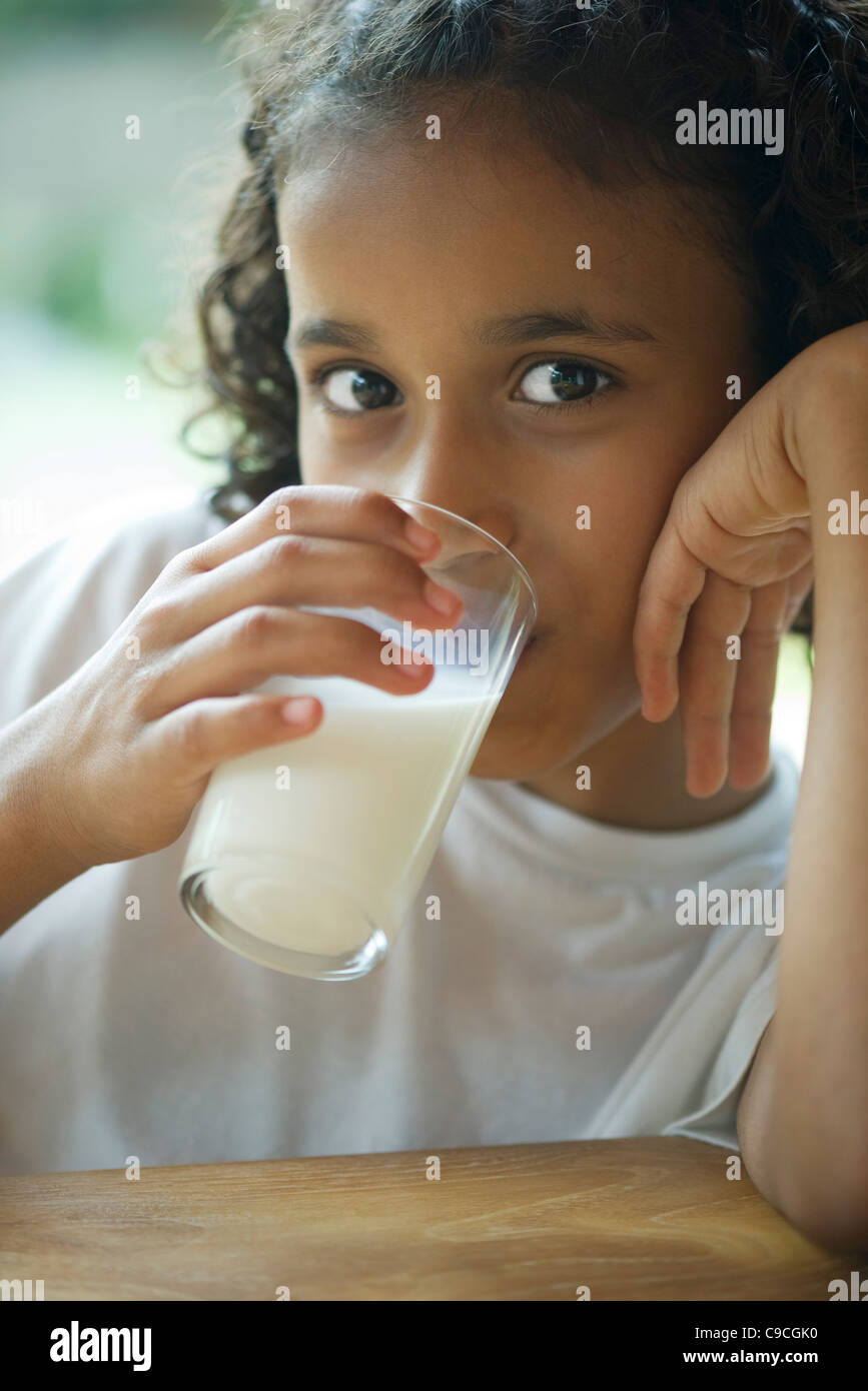 Girl drinking milk Stock Photo - Alamy