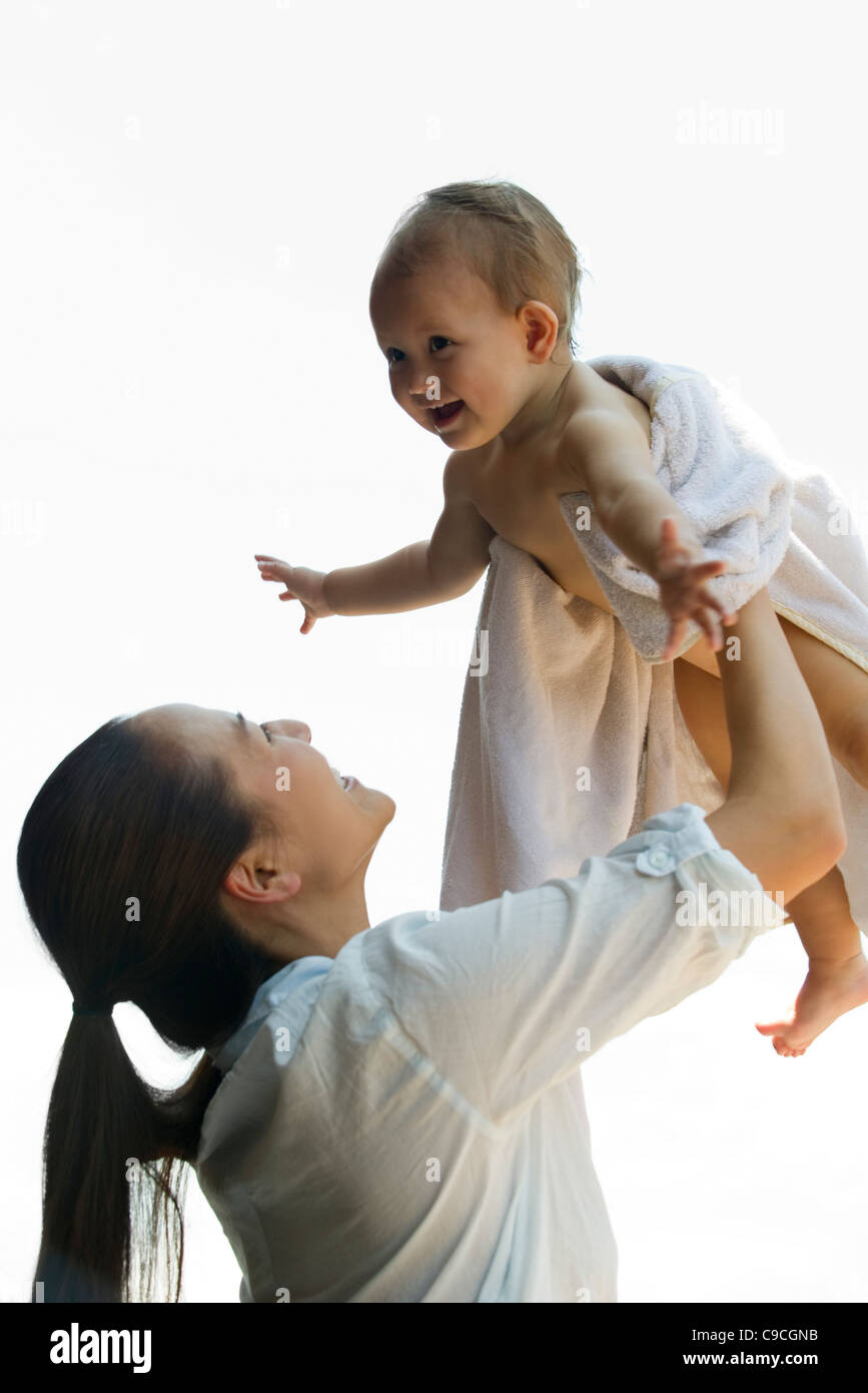 Lifting up babies hi-res stock photography and images - Alamy