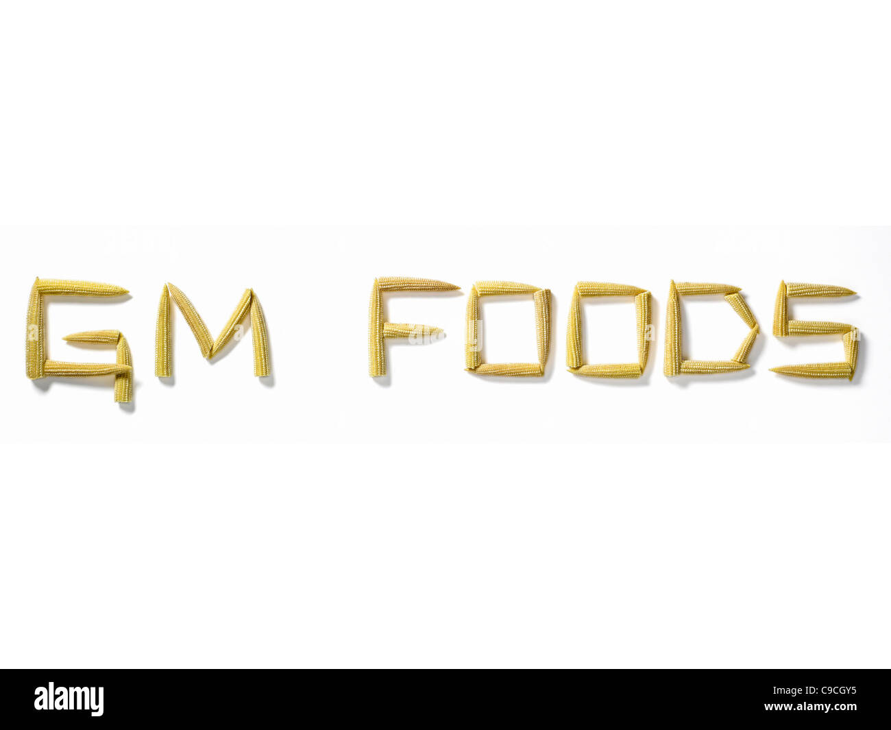 The words"GM Foods" written with small corn on the cobs Stock Photo - Alamy