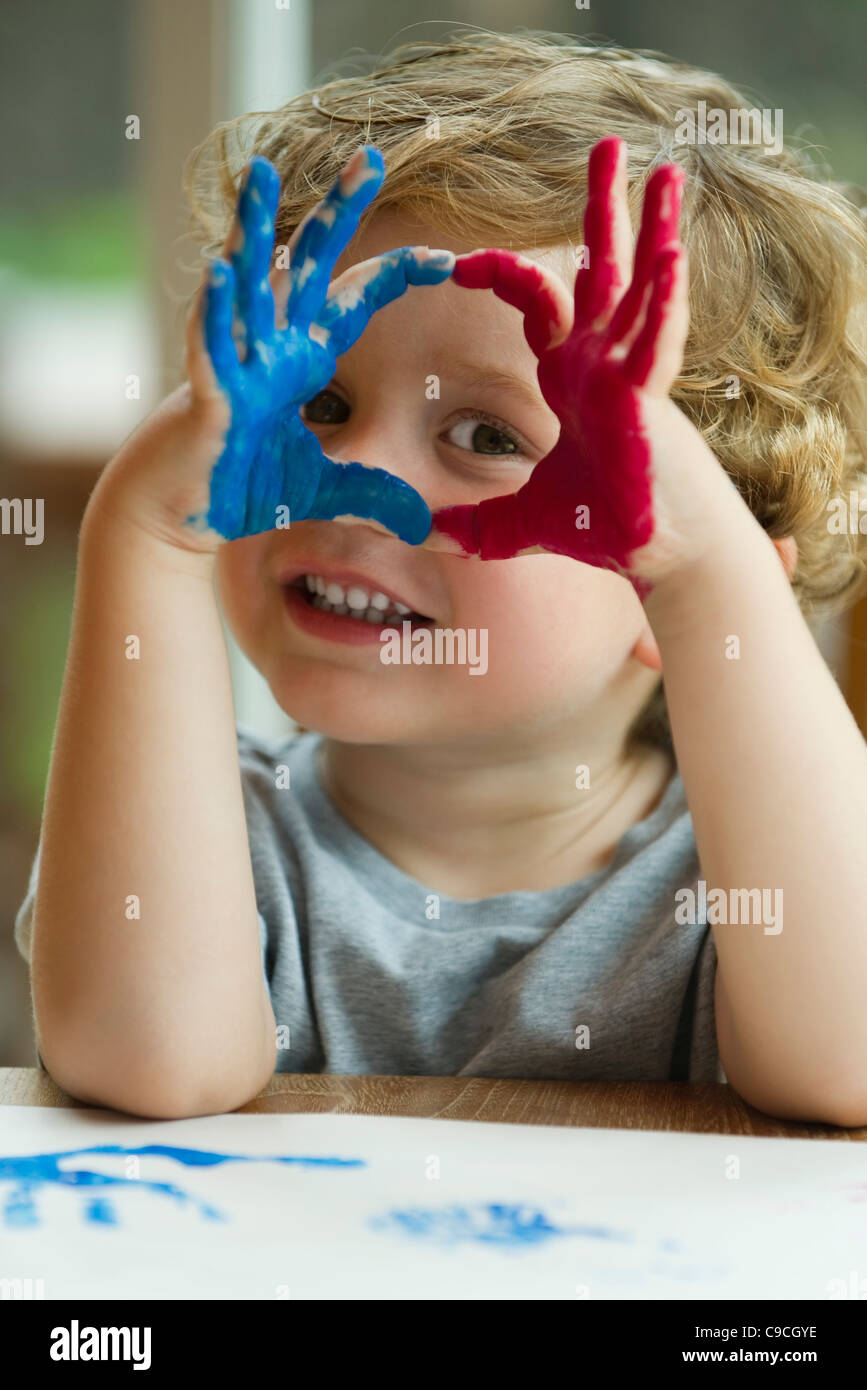 Kids hand covered in paint hi-res stock photography and images - Alamy