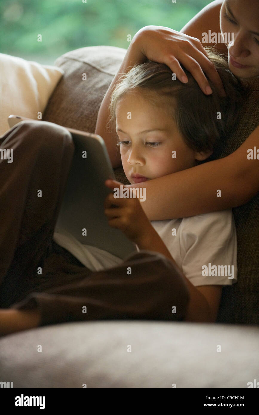 Kids tablet behind hi-res stock photography and images - Alamy