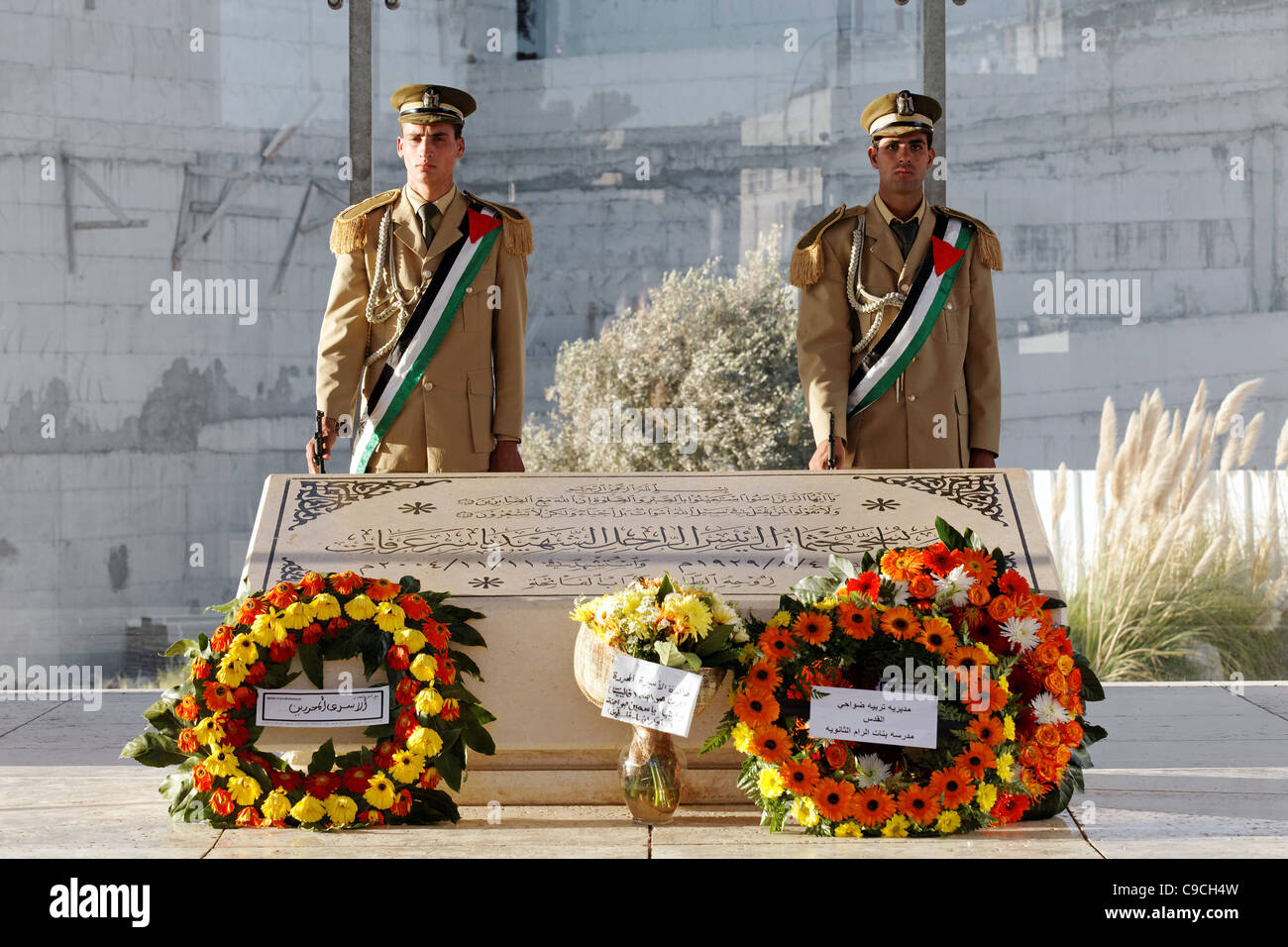 Palestinian guards standing guard at Arafat's grave in his former ...