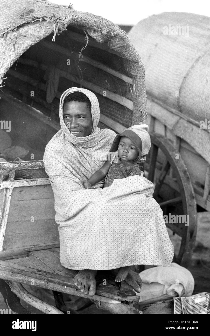 Mahafaly Man and Child or Father and Son Wrapped in a Lamba & Sitting ...