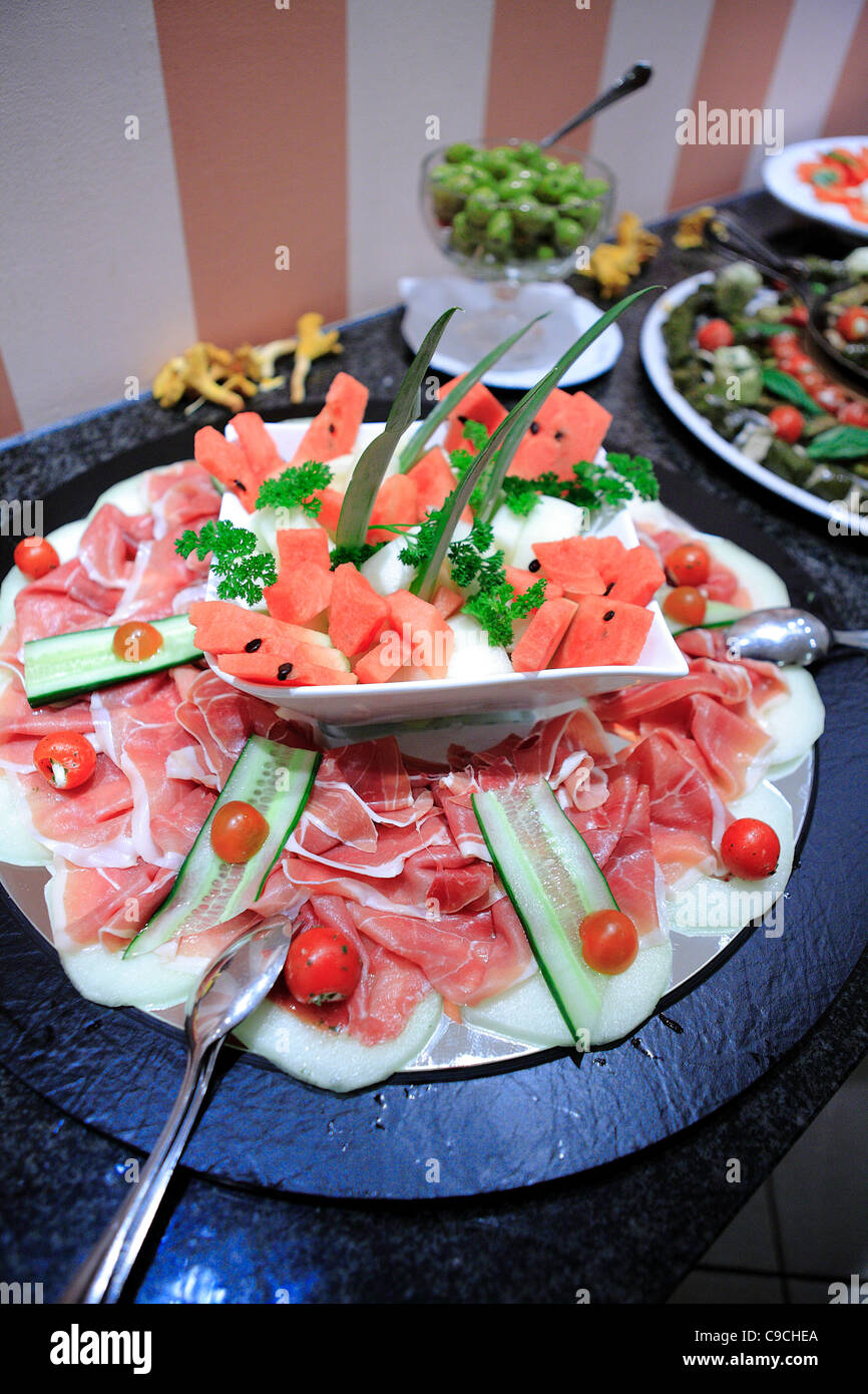 fruit plate with melon and bacon at buffet at german wedding party ...