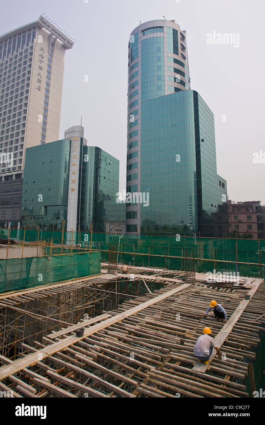 GUANGZHOU, GUANGDONG PROVINCE, CHINA - Construction workers in front of ...