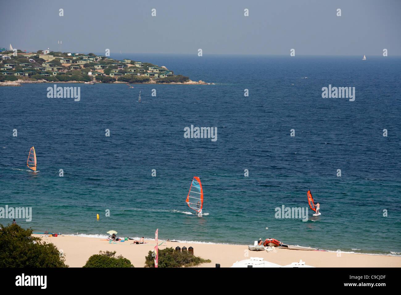 Surfing at Porto Pollo beach, Sardinia, Italy Stock Photo - Alamy