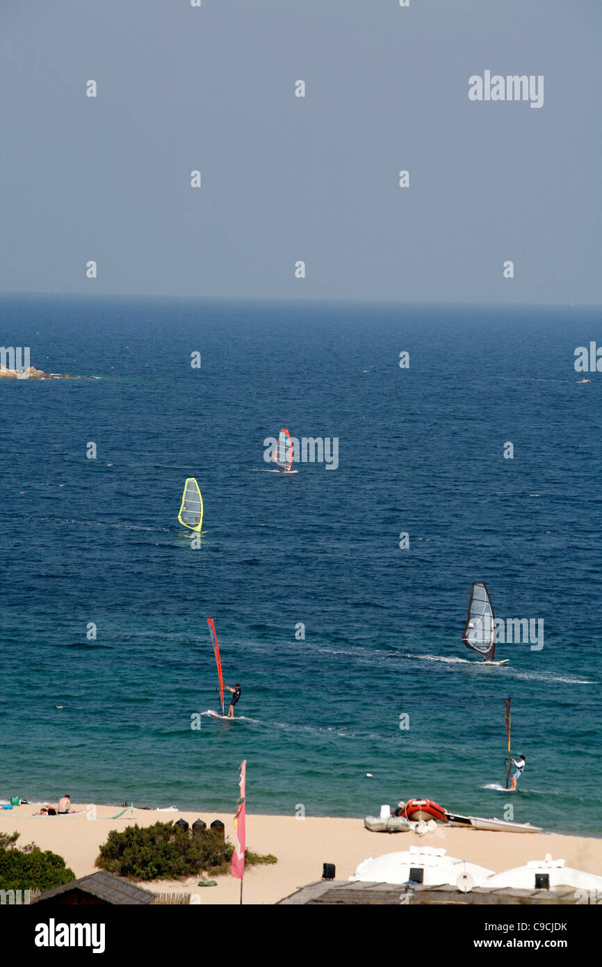 Surfing at Porto Pollo beach, Sardinia, Italy Stock Photo - Alamy