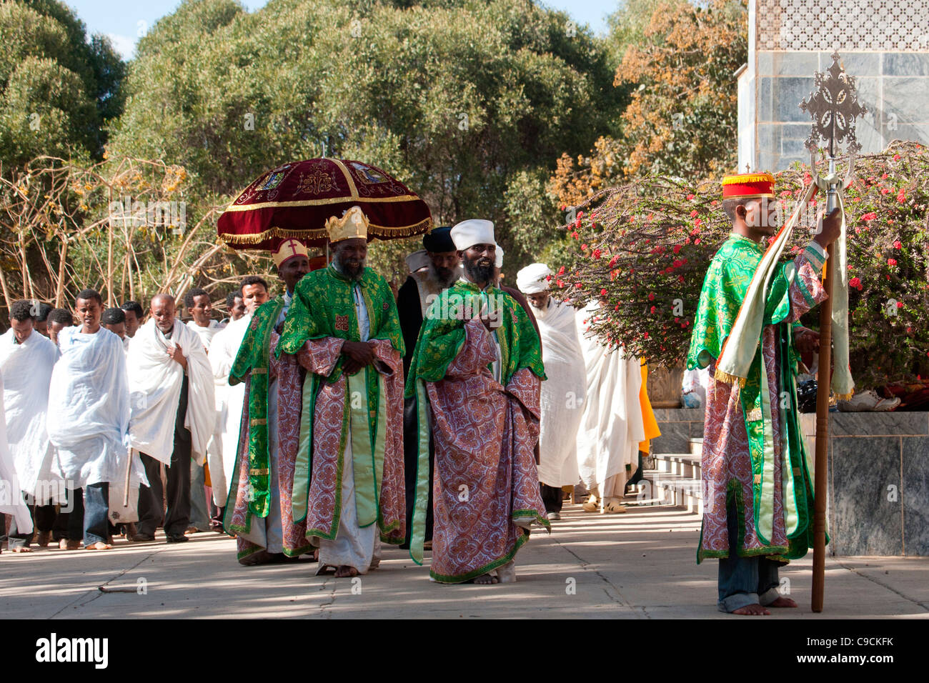 Orthodox Christian priests lead a procession of devotees around the new ...
