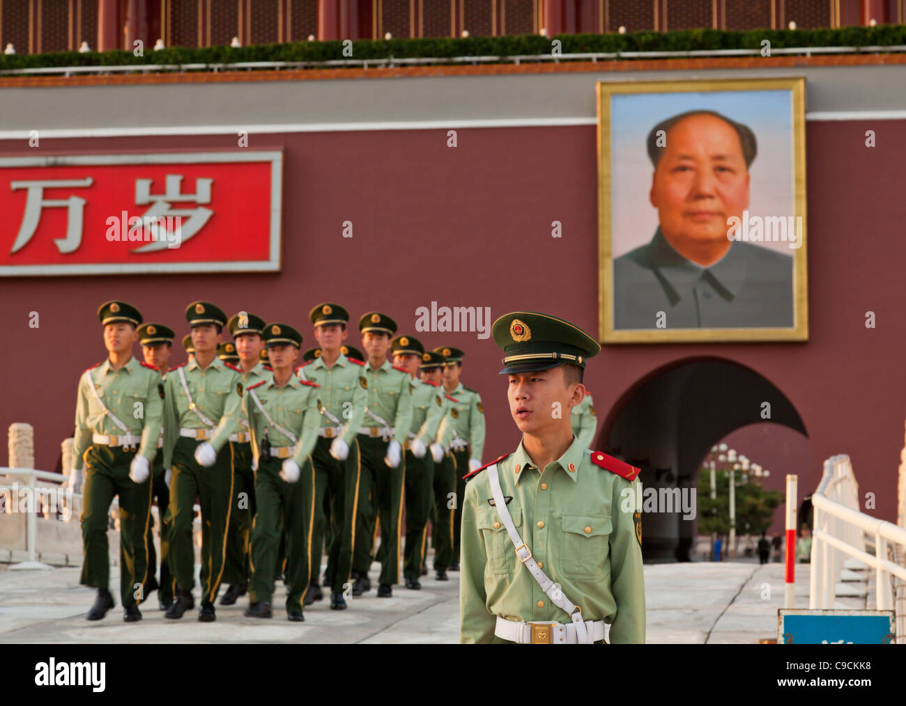Chinese soldiers marching from the Tiananmen Tower under Chairman Mao's ...
