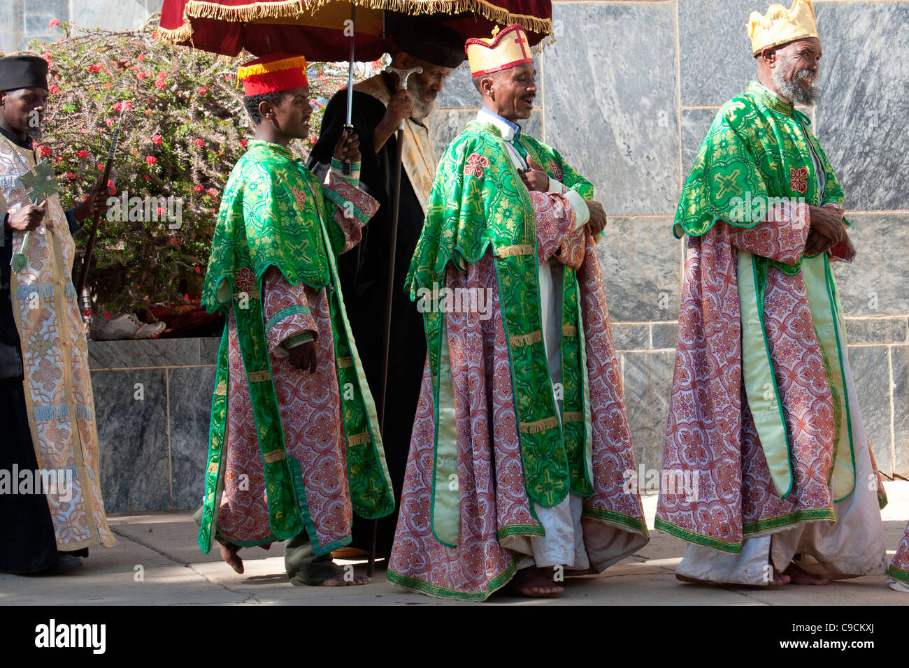 Orthodox Christian priests lead a procession of devotees around the new ...