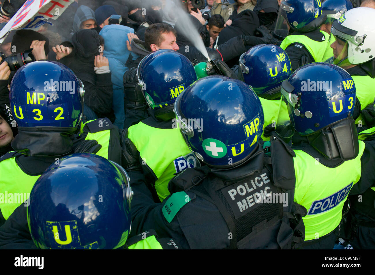 Police medic assaulting protestor with fire extinguisher, Day X Student ...