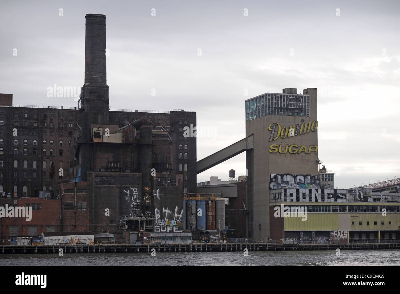 Long Island old dockyard and Domino Sugar plant seen from tourist boat ...