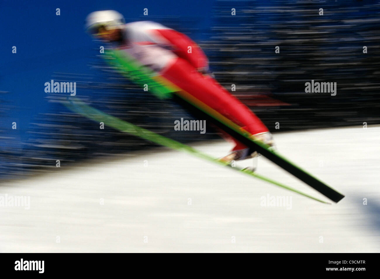 Blurred action of ski jumper flying through the air Stock Photo - Alamy