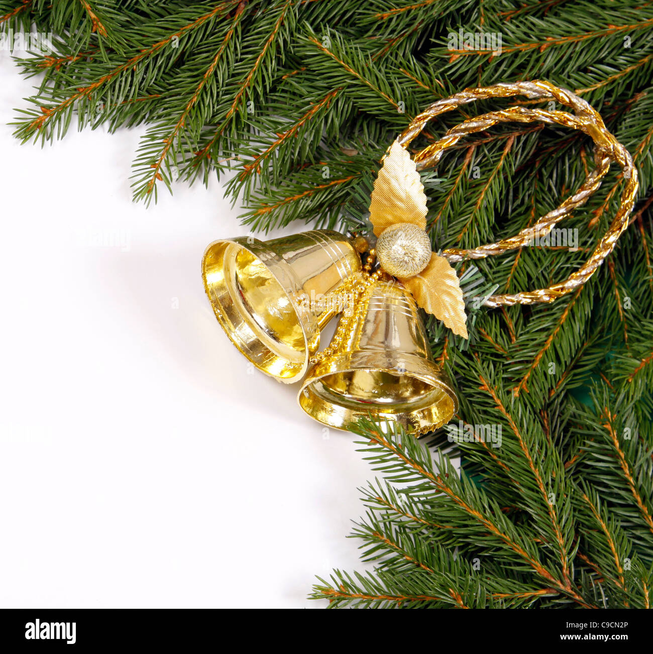 Two golden bells on the background from twigs of the spruce Stock Photo ...