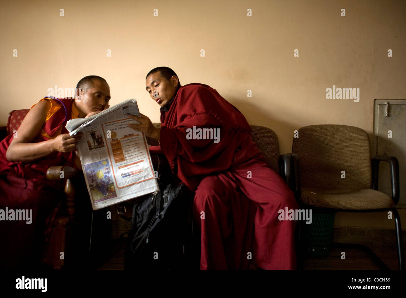 Buddhist monks reading a newspaper at the Vajra Vidya Institute for ...