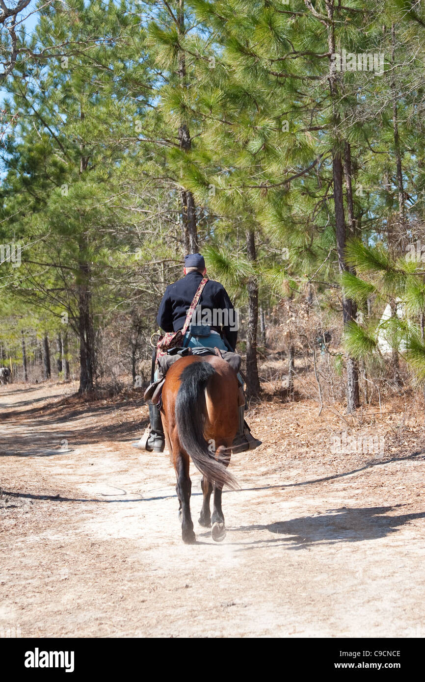 Soldier riding a horse down the dirt road hi-res stock photography and ...