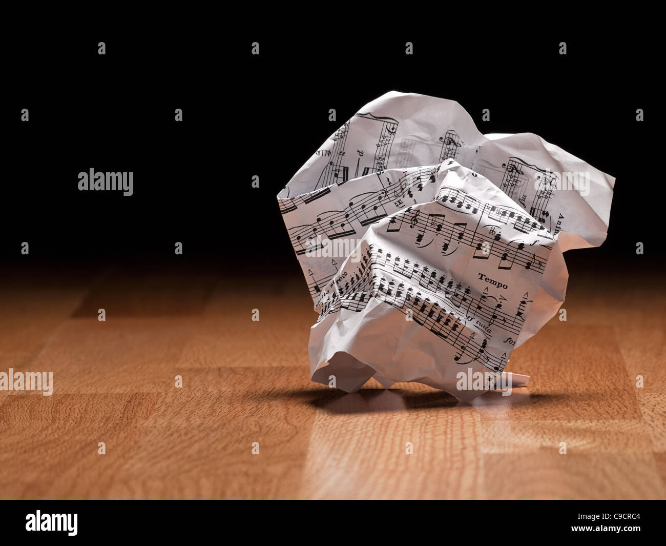 crumpled paper sheet of music notes on the floor, closeup,for music ...