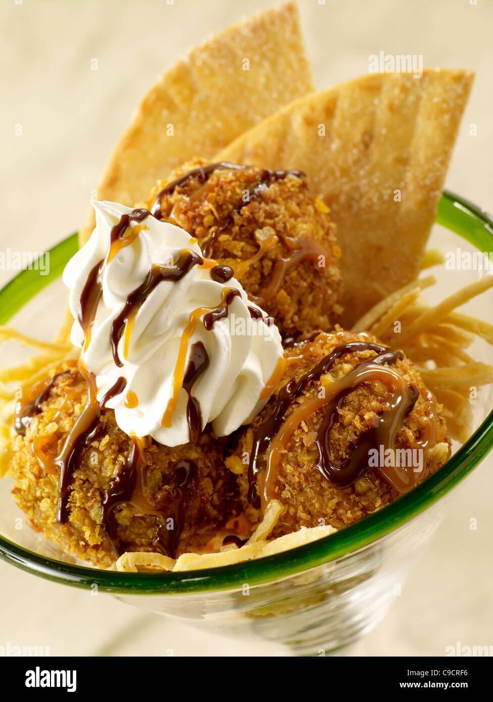 Deep fried ice cream sprinkled with chocolate and caramel sauce and ...
