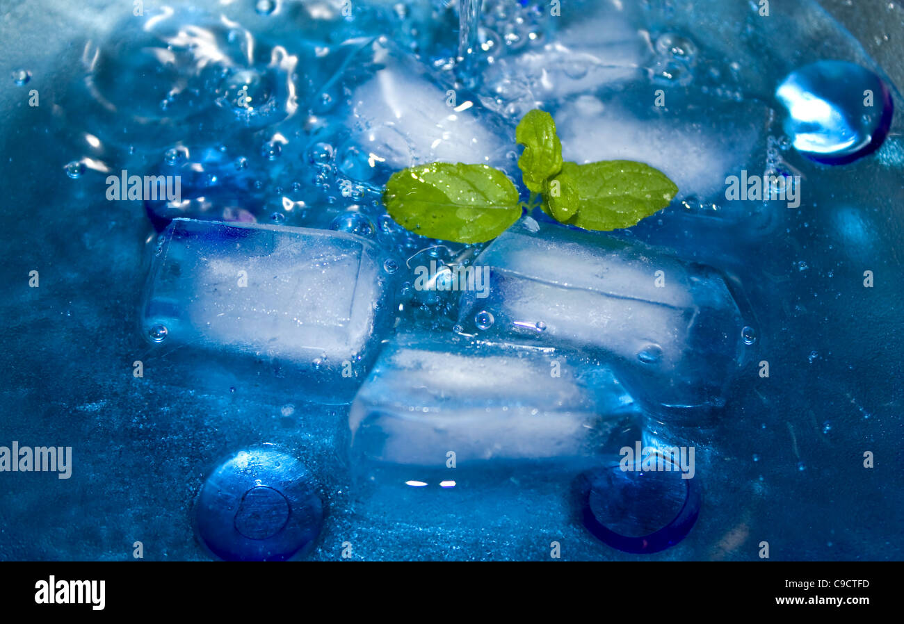 Drinks - Cocktail mix with ice cubes and mint Stock Photo - Alamy