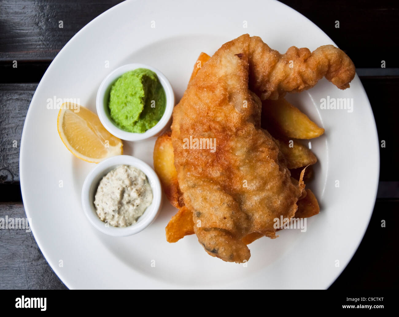 Delicious battered fish chips served hi-res stock photography and ...