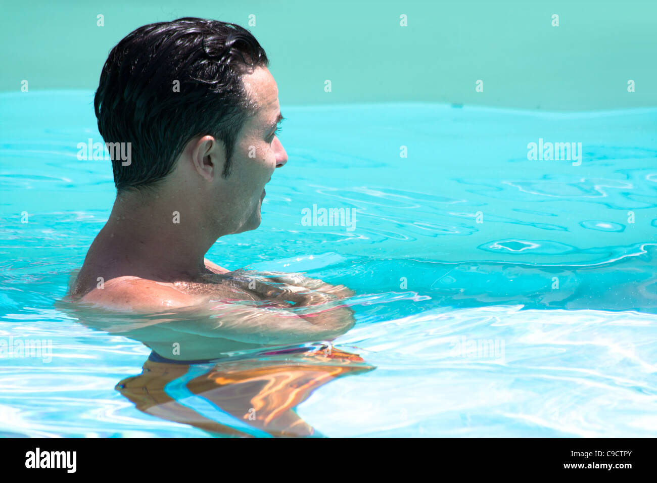 Young Man In The Swimming Pool Stock Photo - Alamy