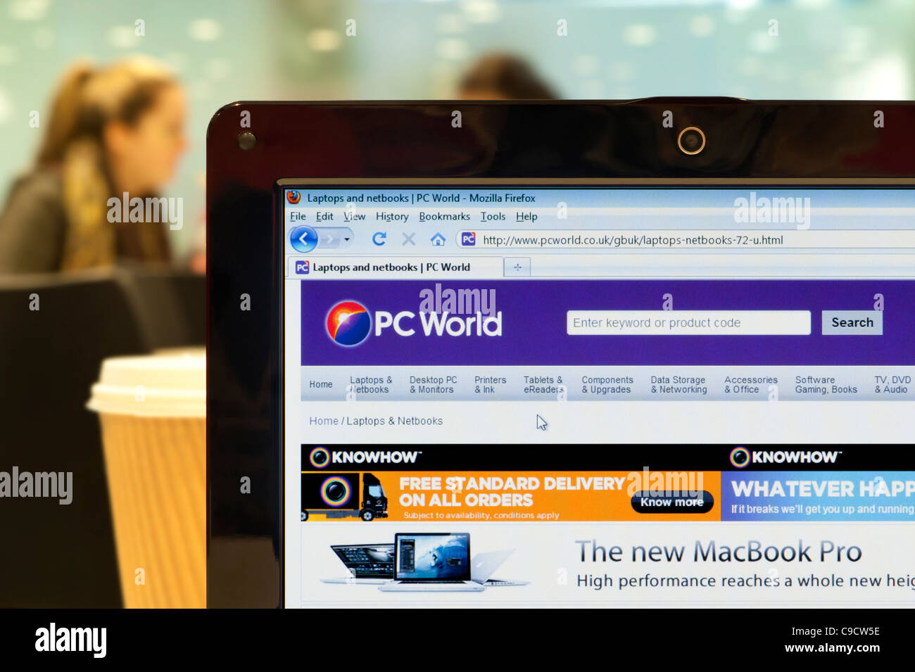 The PC World website shot in a coffee shop environment (Editorial use ...