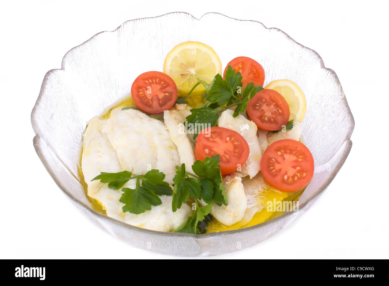 Bowl with cod fish salad isolated on white background Stock Photo - Alamy