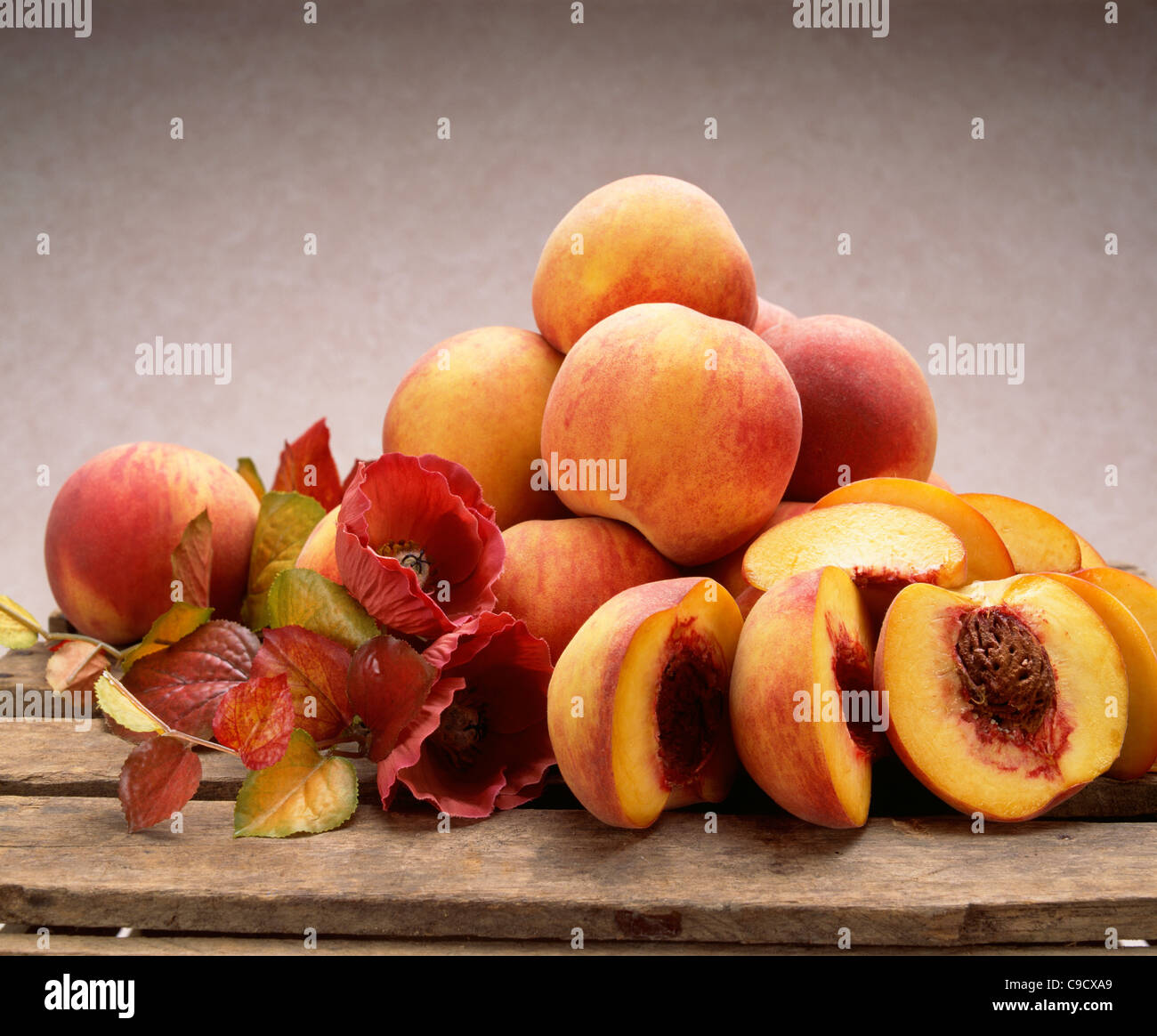Yellow freestone peaches whole and halved showing stone Stock Photo - Alamy