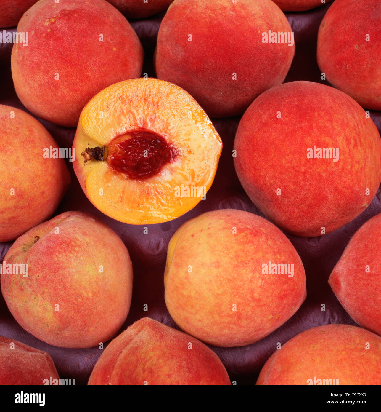 Ruston Red Peaches, whole and half showing stone, Georgia Stock Photo ...