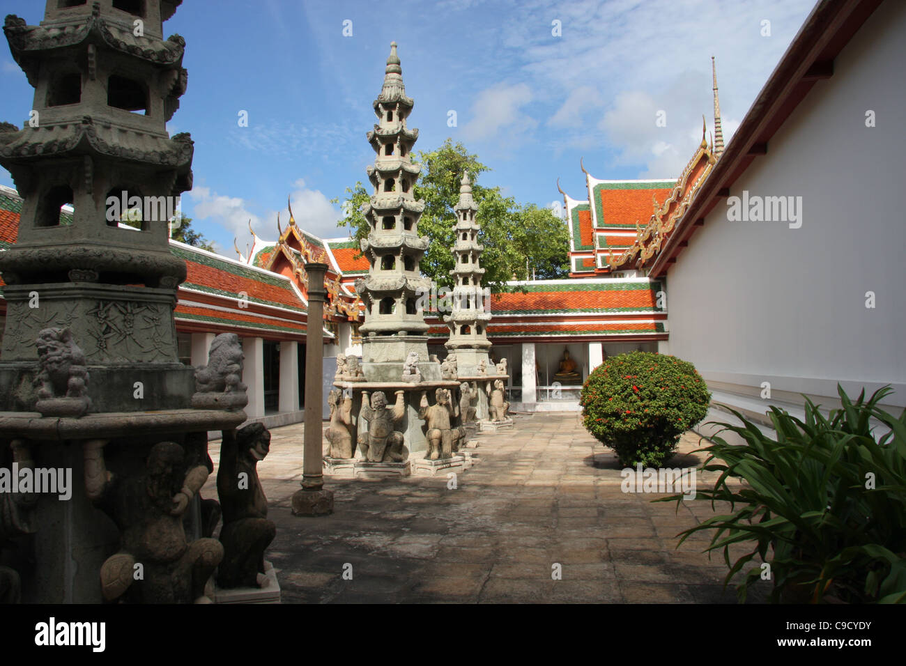 Buildings and statues at Wat Pho, Temple of the Reclining Buddha ...