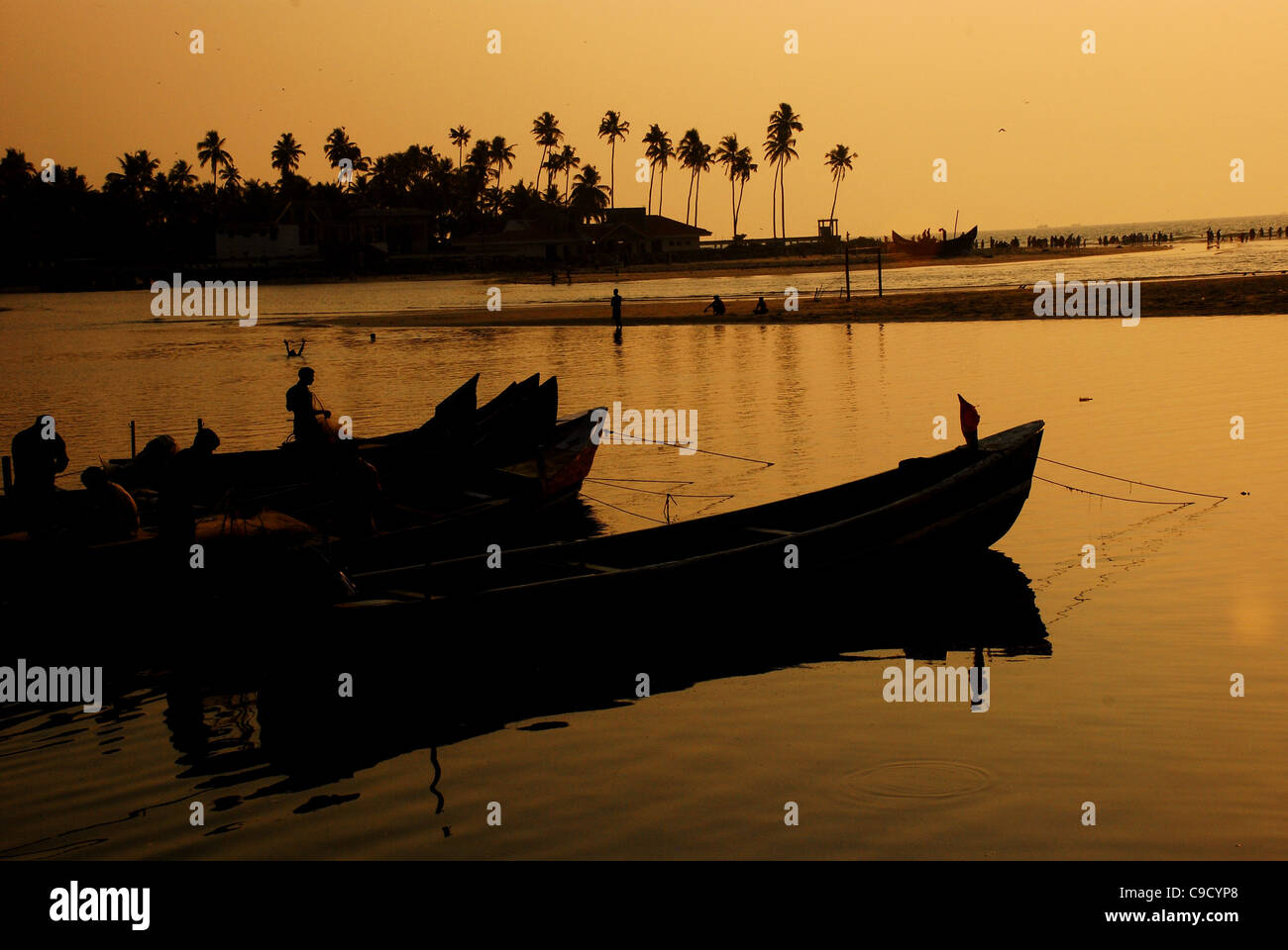 Sunset by a beach in Kerala Stock Photo - Alamy