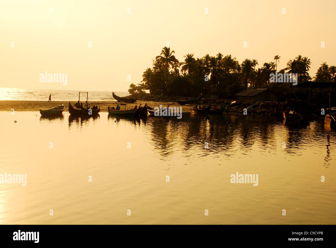 Sunset by a beach in Kerala Stock Photo - Alamy