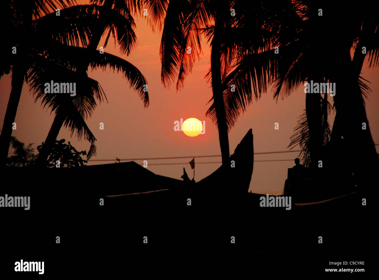 Sunset by a beach in Kerala Stock Photo - Alamy