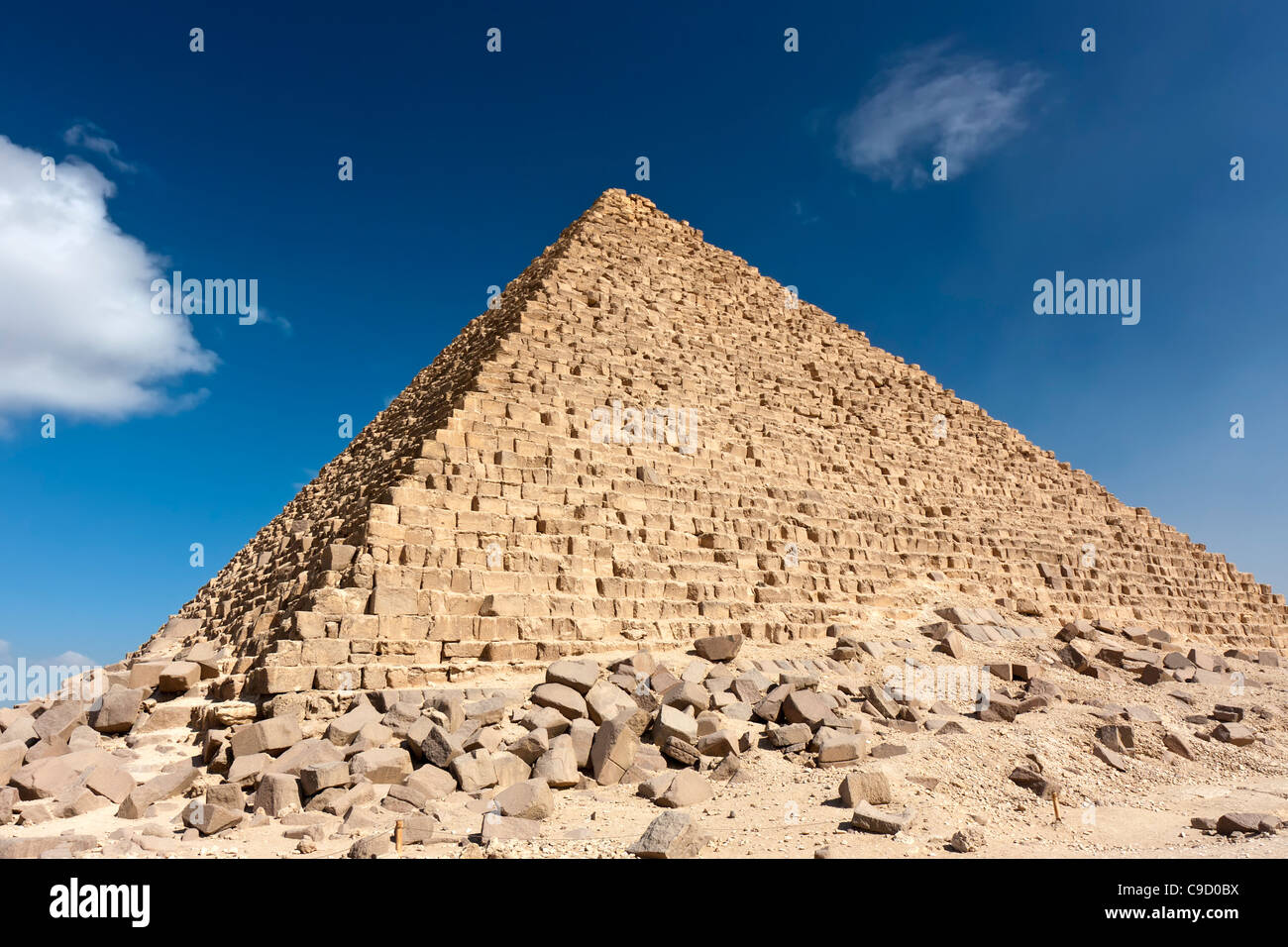 The pyramid of Menkaure with the remains of its original cladding next ...