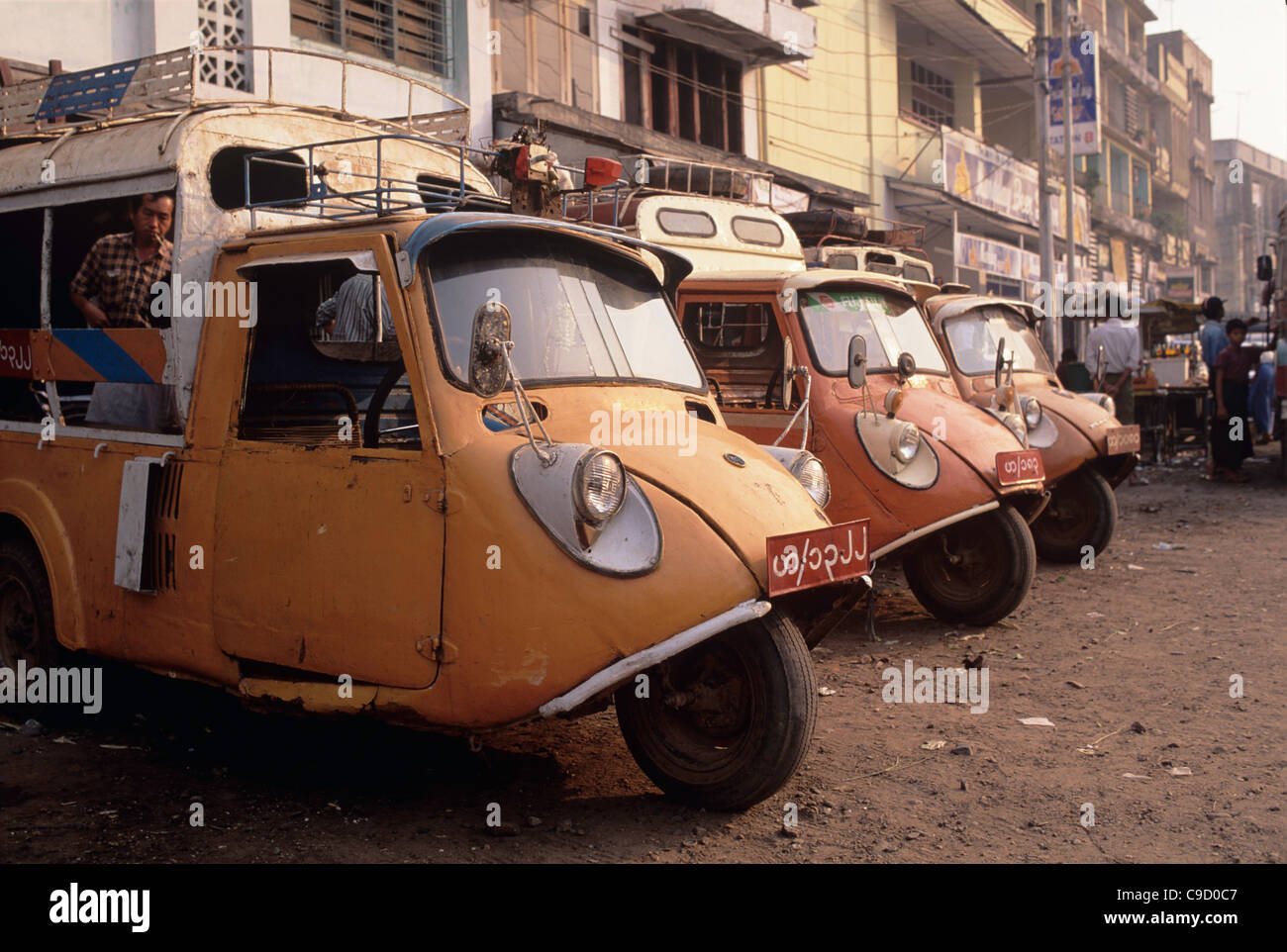 Bago(Pegu) City scene, three wheeled taxis Stock Photo - Alamy