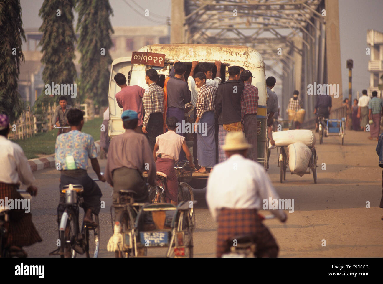 Bago(pegu) city scene, city transport, bus, bike, people crossing ...