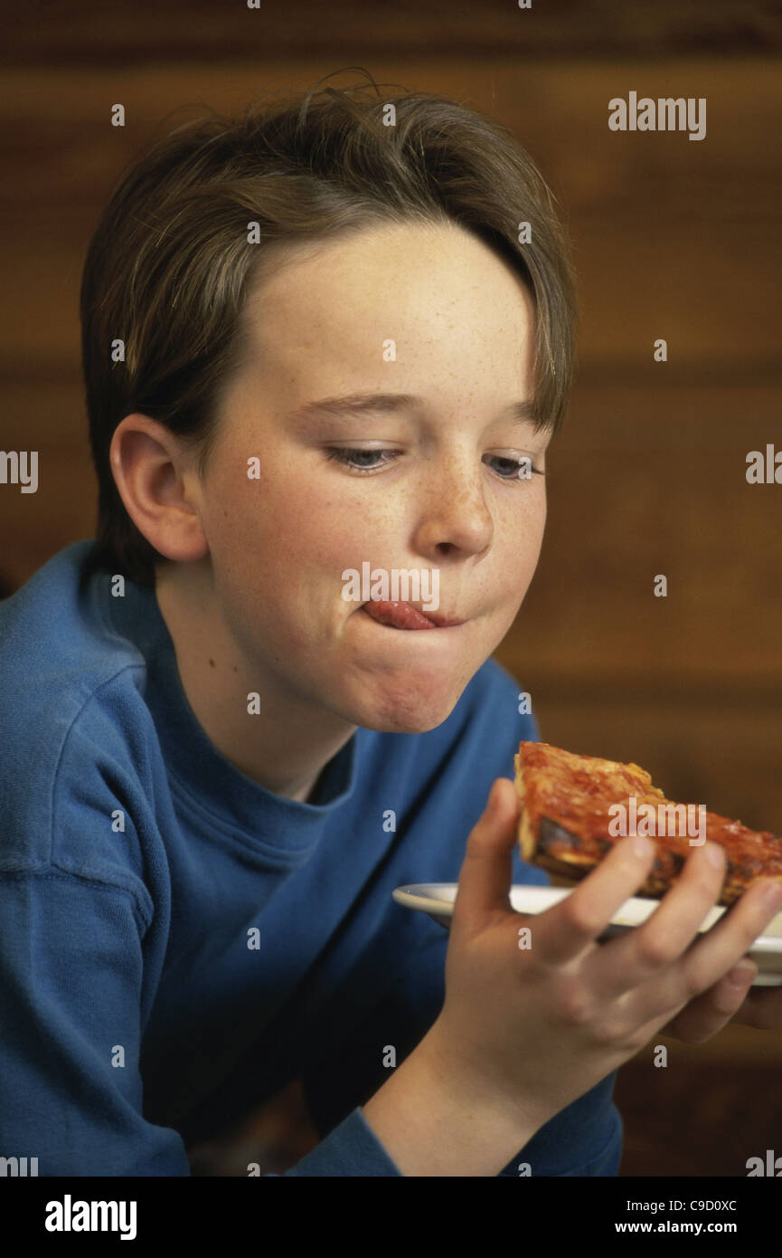 Child eating unhealthy snack hi-res stock photography and images - Alamy