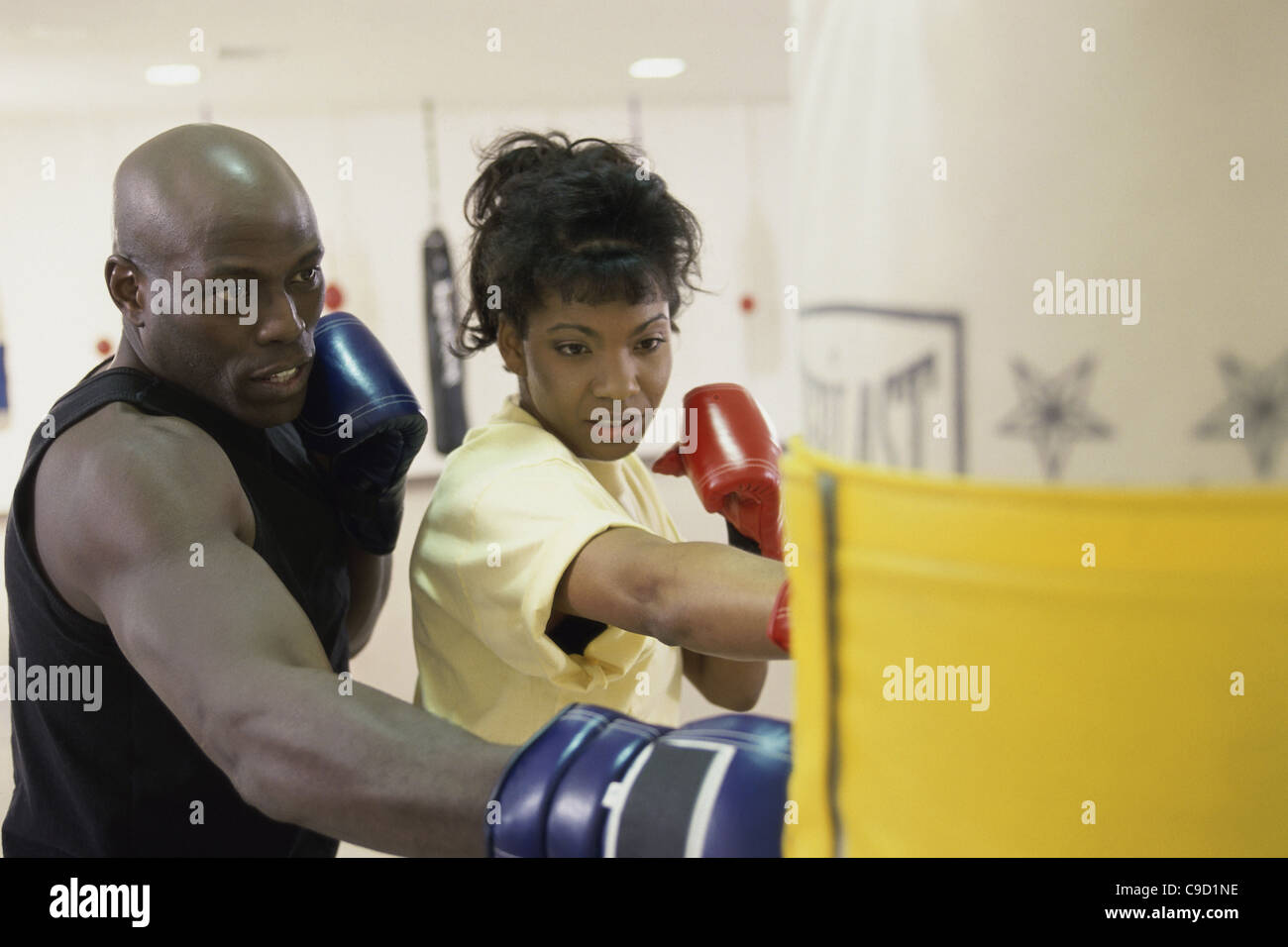 Young male coach coaching a female boxer Stock Photo - Alamy