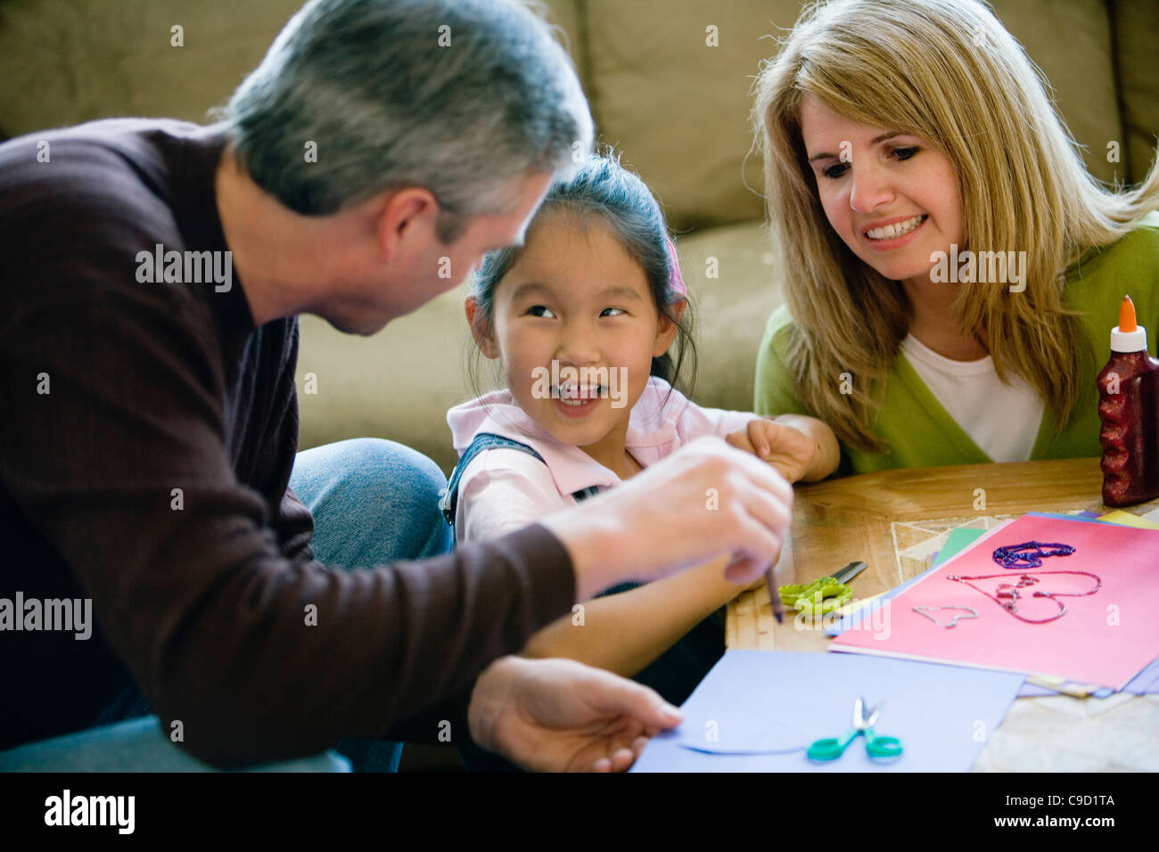 Attentive mother helps cute daughter hi-res stock photography and ...