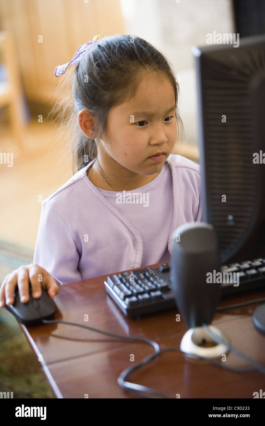 Young Asian giirl using computer Stock Photo - Alamy