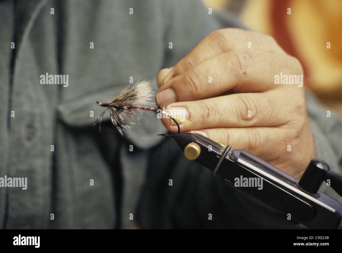 Person making a fishing lure Stock Photo - Alamy